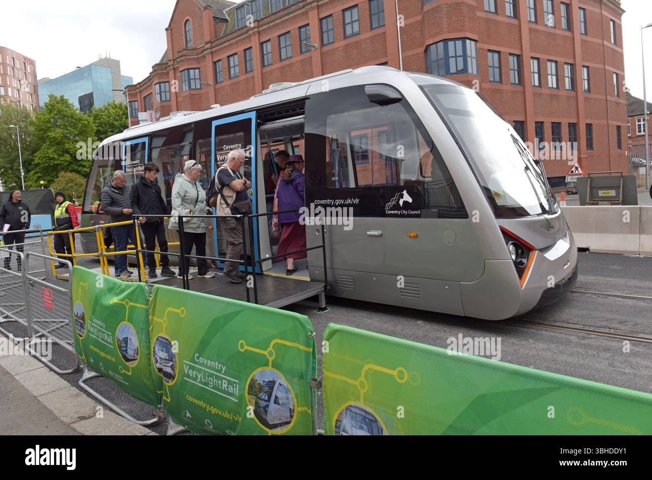 passengers getting on the Coventry VLR Very Light Rail test track, the ...