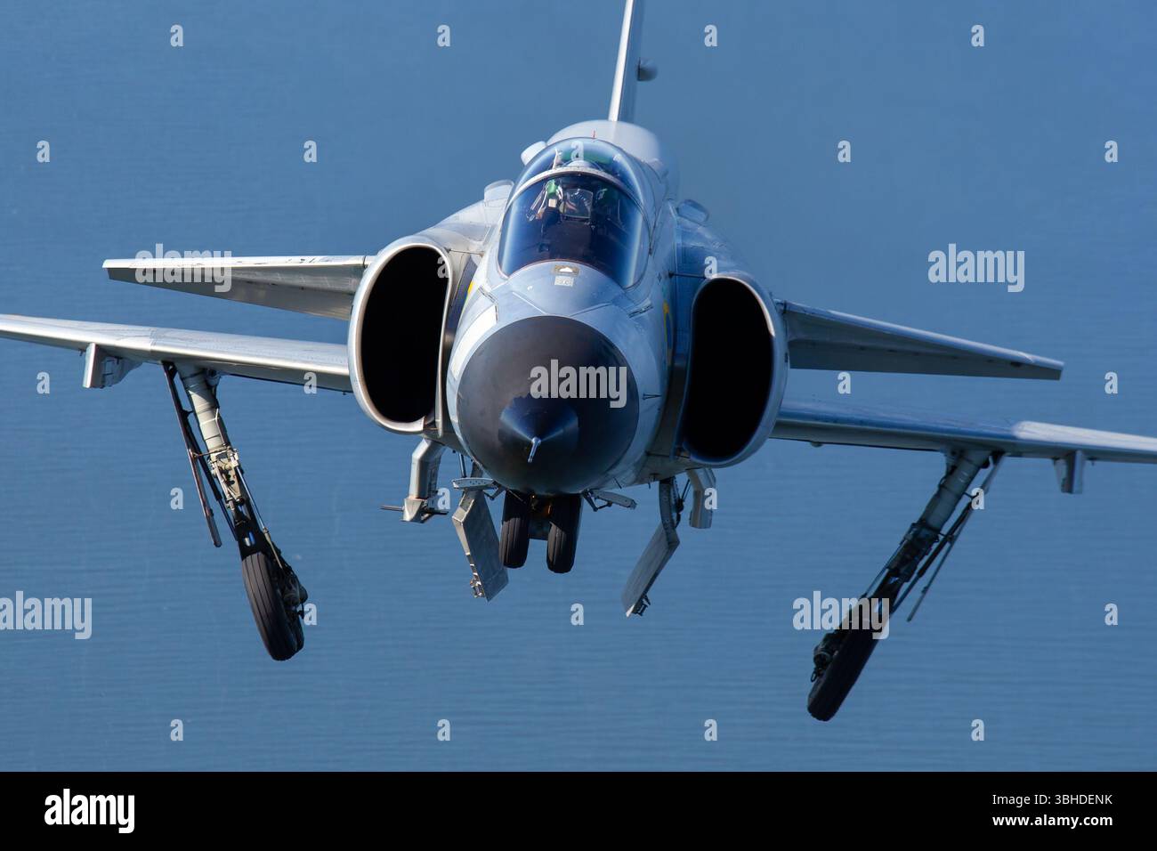 In a powerful air-to-air shot, a Saab AJS37 Viggen with registration SE ...
