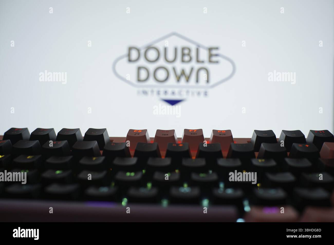 Double Down Interactive logo above a backlit keyboard Stock Photo - Alamy