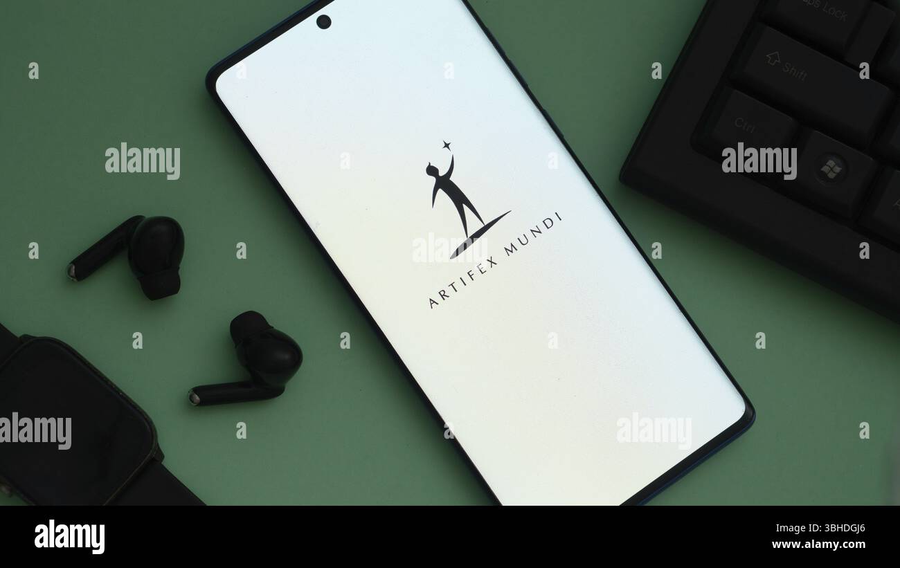 Artifex Mundi logo shown on a smartphone with earphones on a green ...