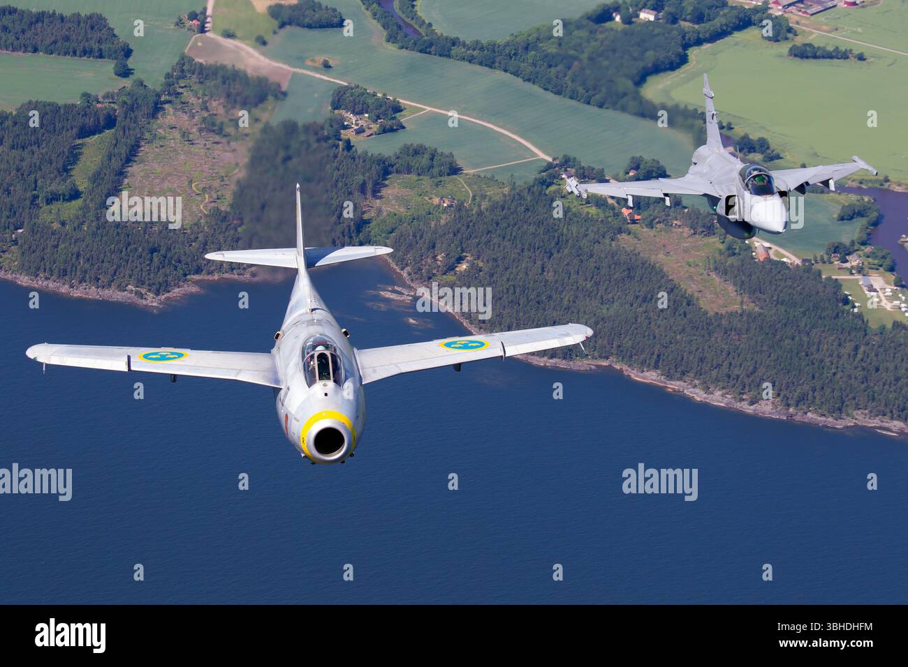 A Saab J29F Tunnan (Reg. 10-R) and Saab JAS-39C Gripen (Reg. 225) of ...