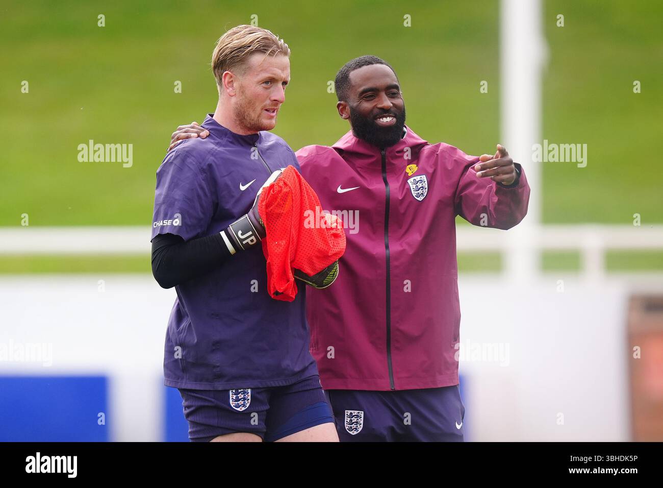 England goalkeeper Jordan Pickford (left) and coach Justin Cochrane ...