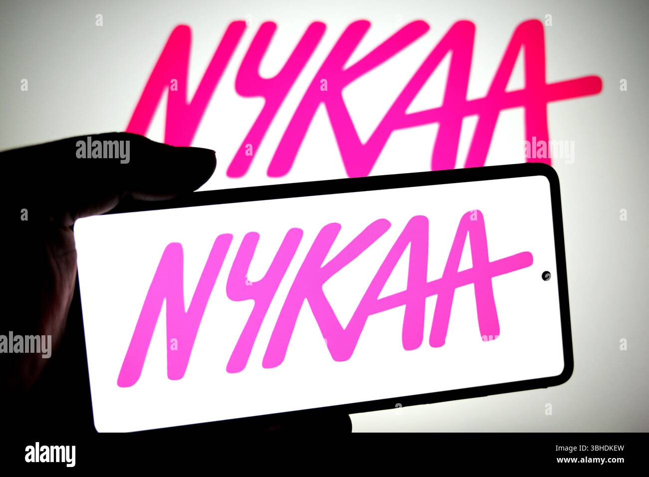 In this photo illustration, a Nykaa logo is seen displayed on a ...