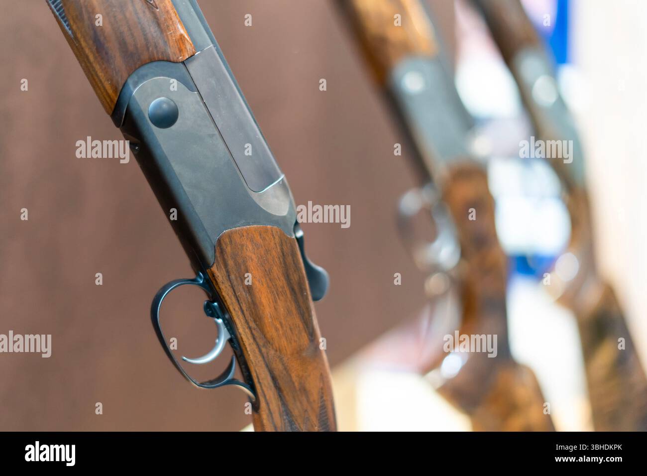 Wood-patterned hunting weapons on display Stock Photo - Alamy