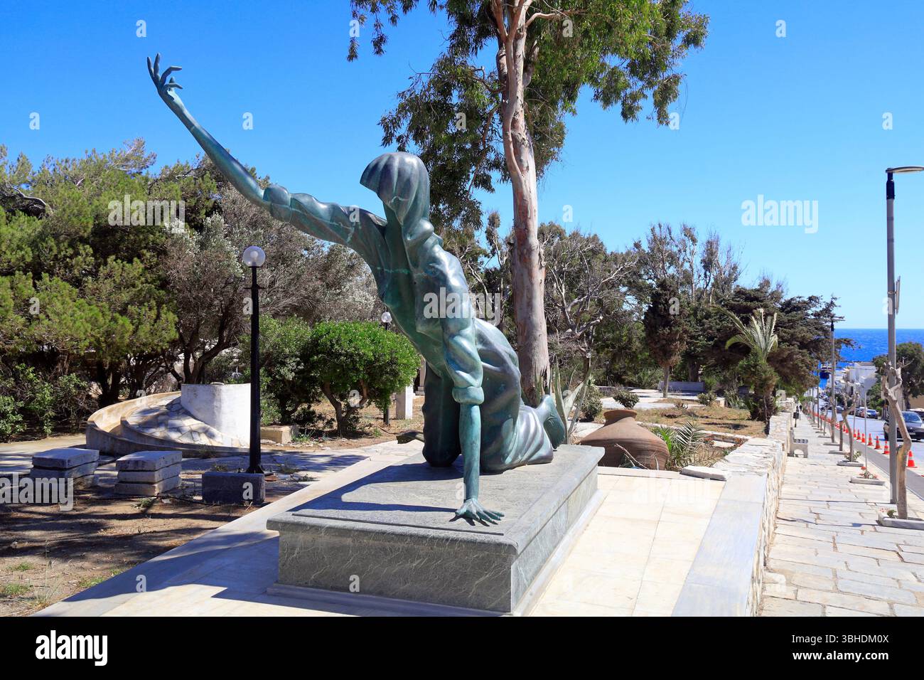 Bronze statue of a figure on hands and knees crawling to the Panagia ...