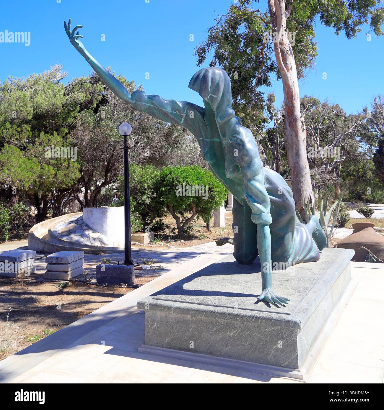 Bronze statue of a figure on hands and knees crawling to the Panagia ...