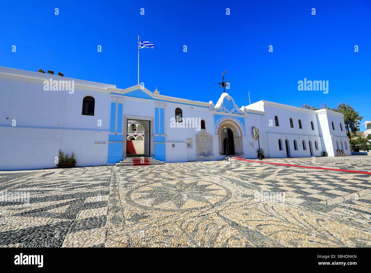 Outer wall and entrance gate and red carpet of Our Lady of Tinos ...