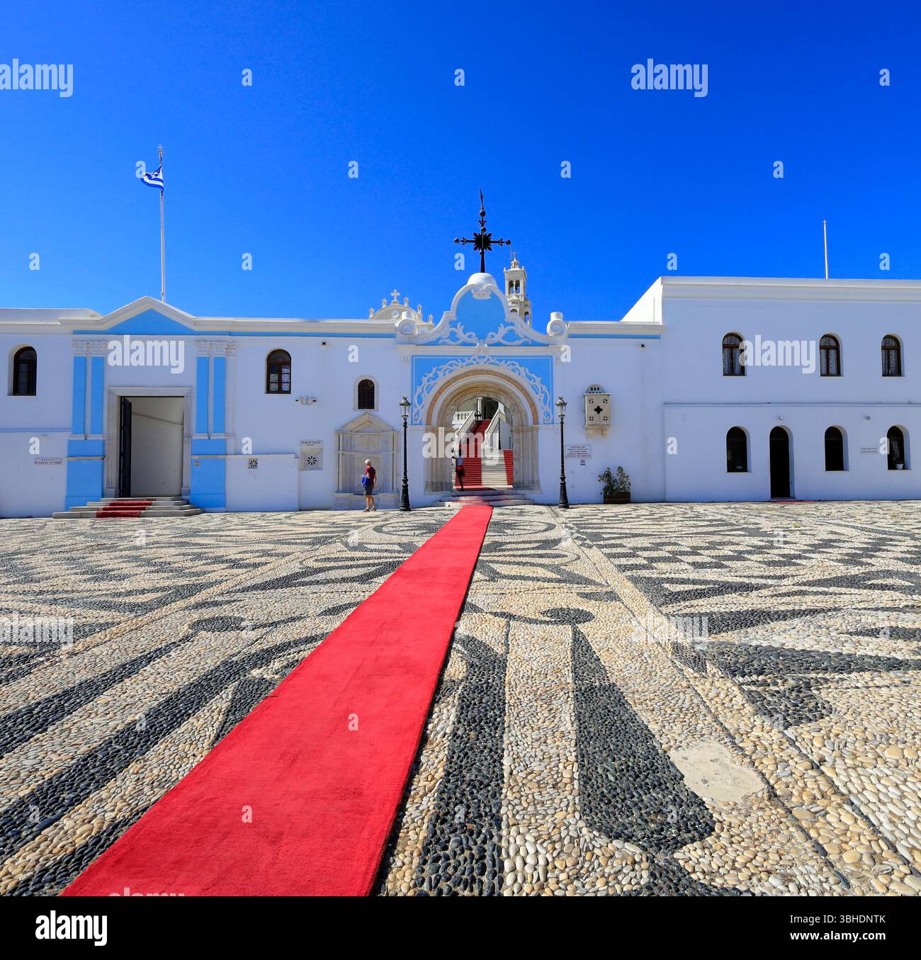 Outer wall and entrance gate and red carpet of Our Lady of Tinos ...
