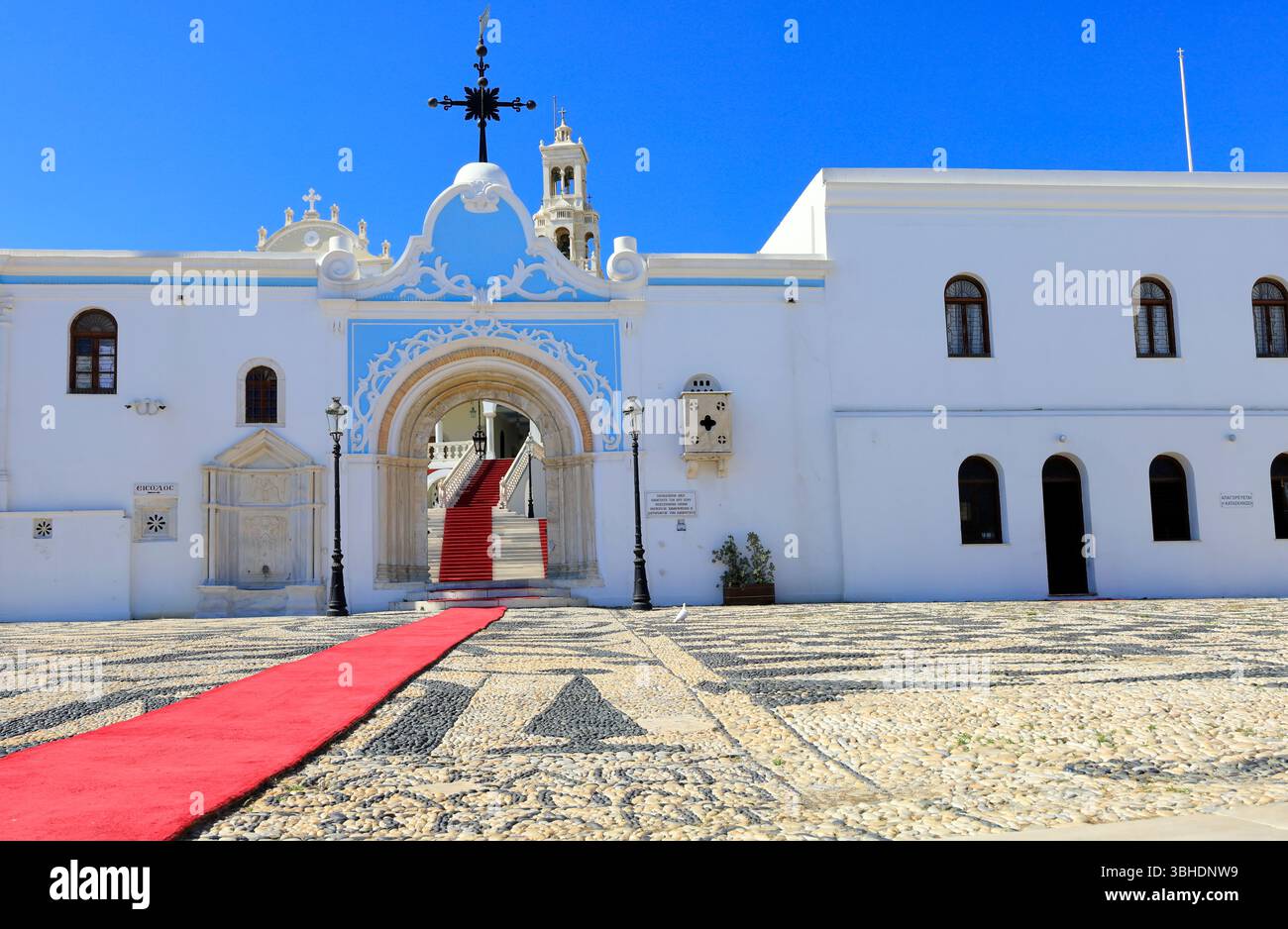 Outer wall and entrance gate and red carpet of Our Lady of Tinos ...