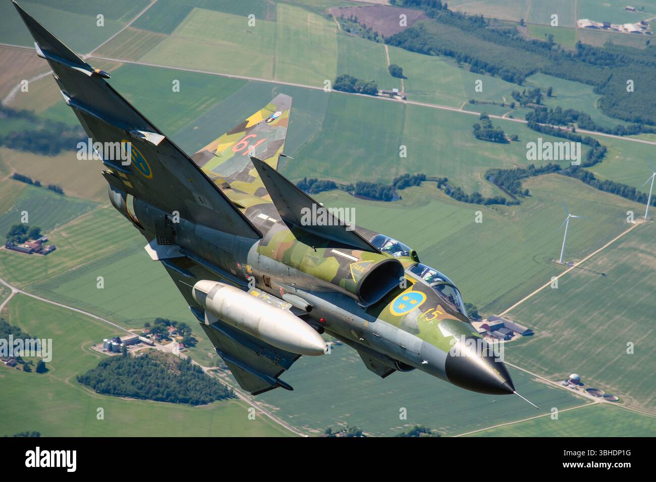 The Saab Sk37E Viggen (Reg. SE-DXO, Military Code 15-61) banks during ...