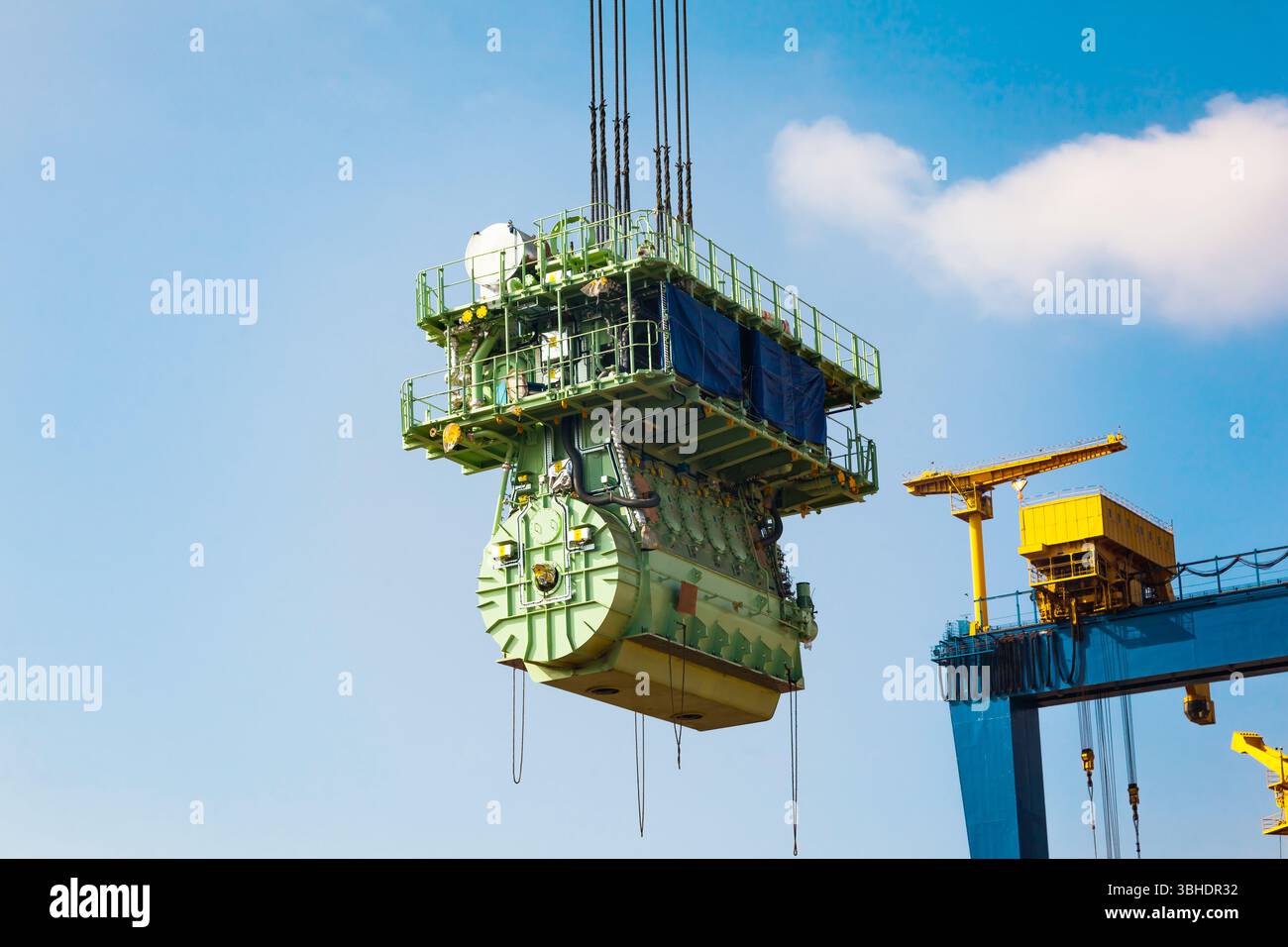 Transportation of a large marine engine by a port crane using steel ...