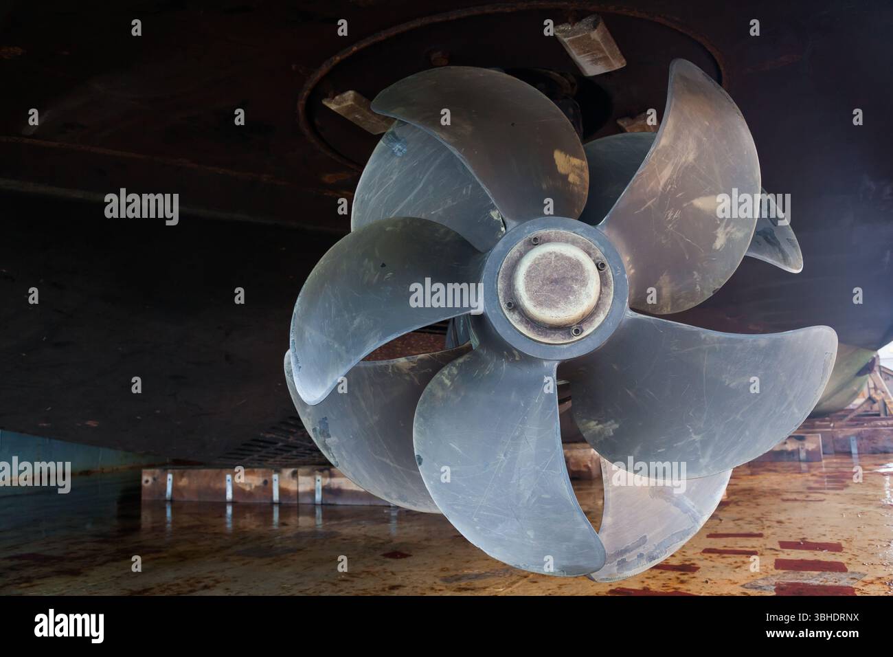 The bottom of a ship supported in dry dock with azimuth propulsion and ...
