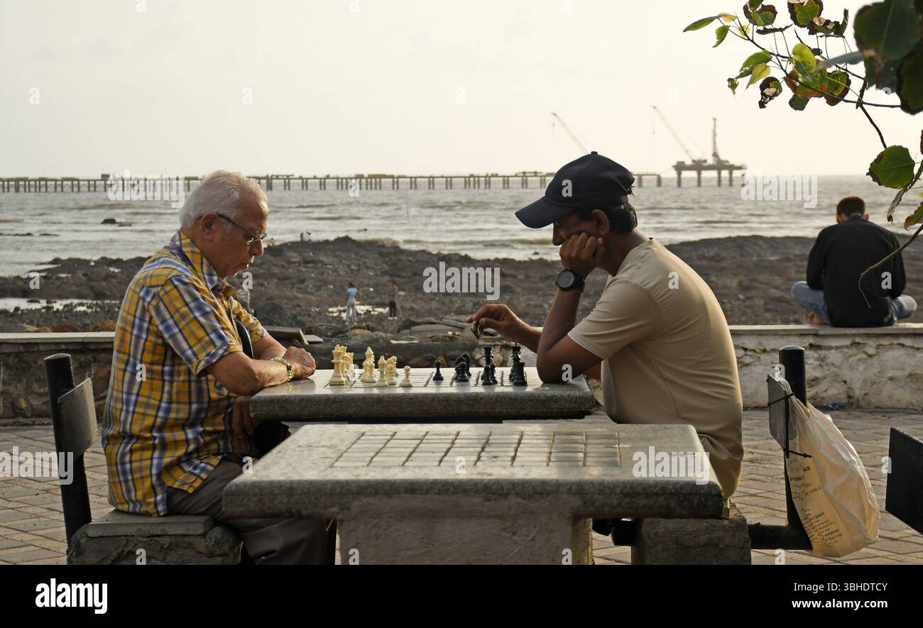 Mumbai, India. 09th June, 2025. People are seen playing chess at a sea ...
