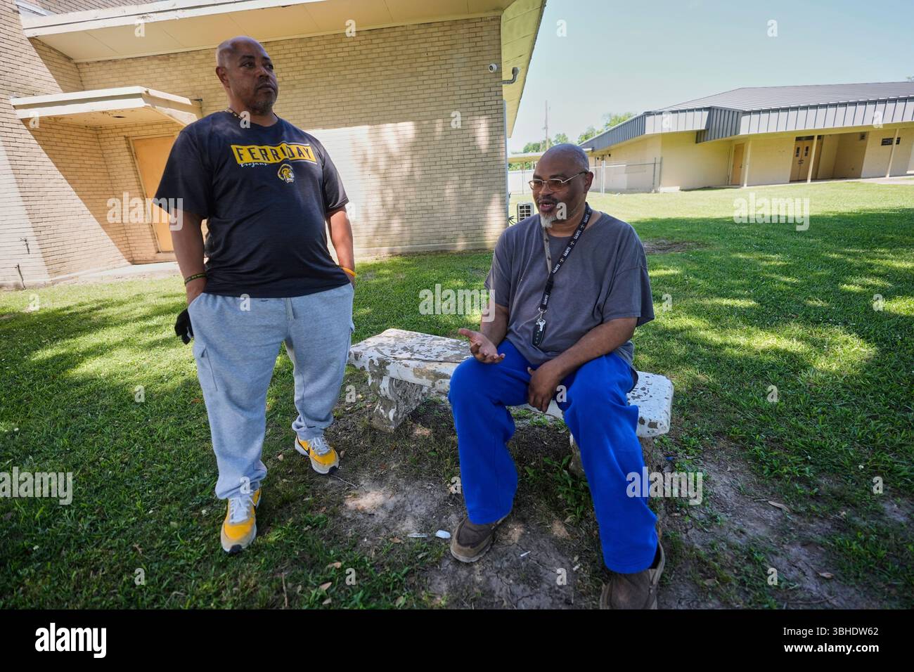 Alumnus Brian Davis, right, and assistant football coach Derrick Davis ...