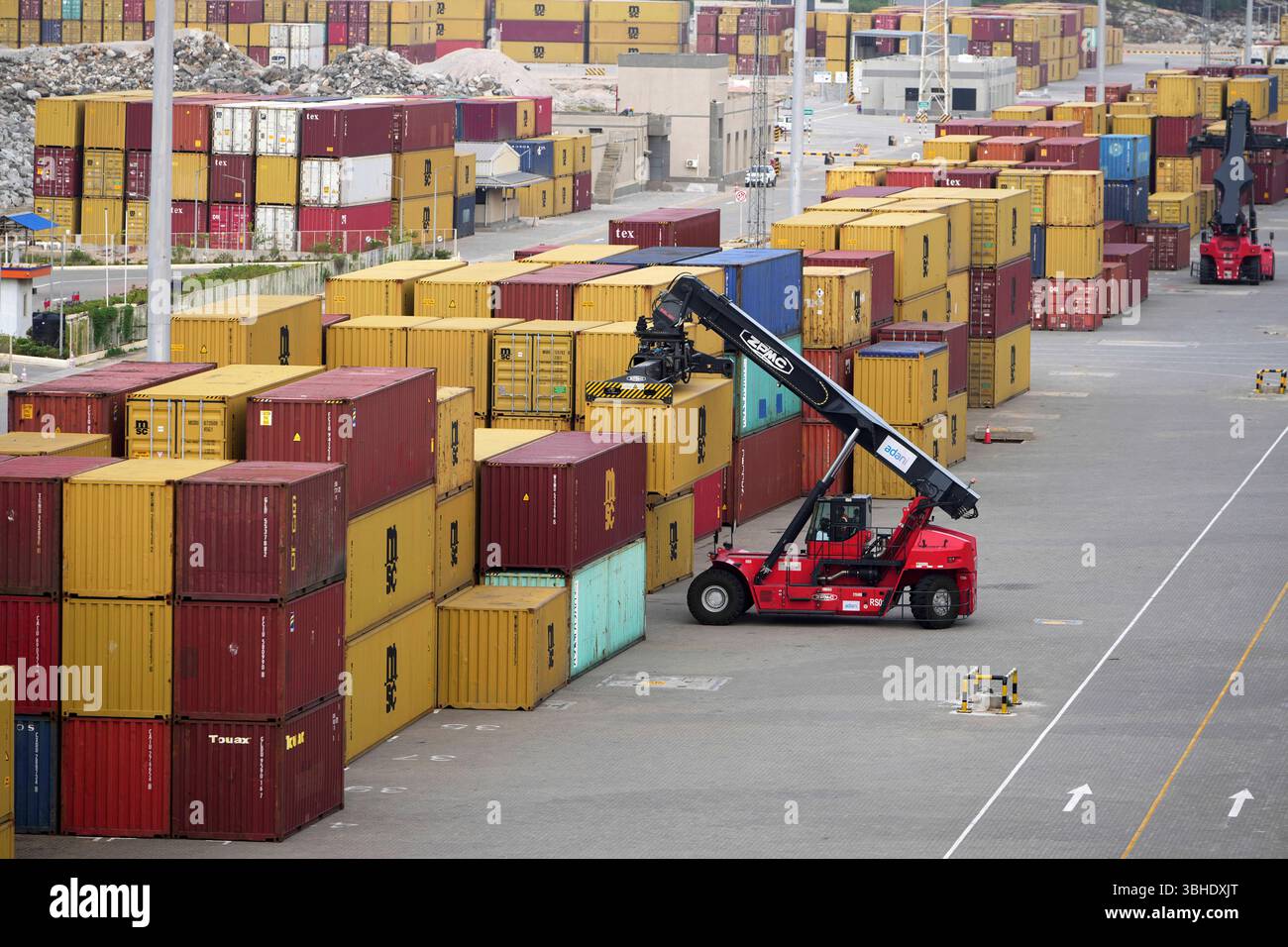 A crane stacks a container at Vizhinjam port in Thiruvananthapuram, India, Monday, June 9, 2025 ...