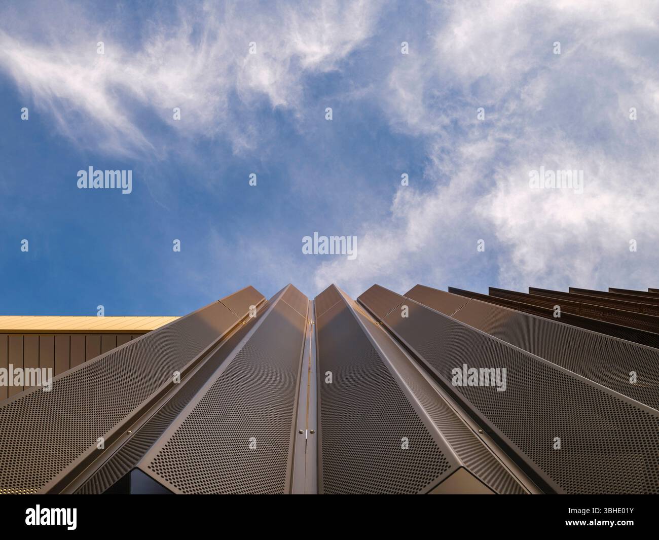 Northern facade detail featuring perforated metal blades looking up ...