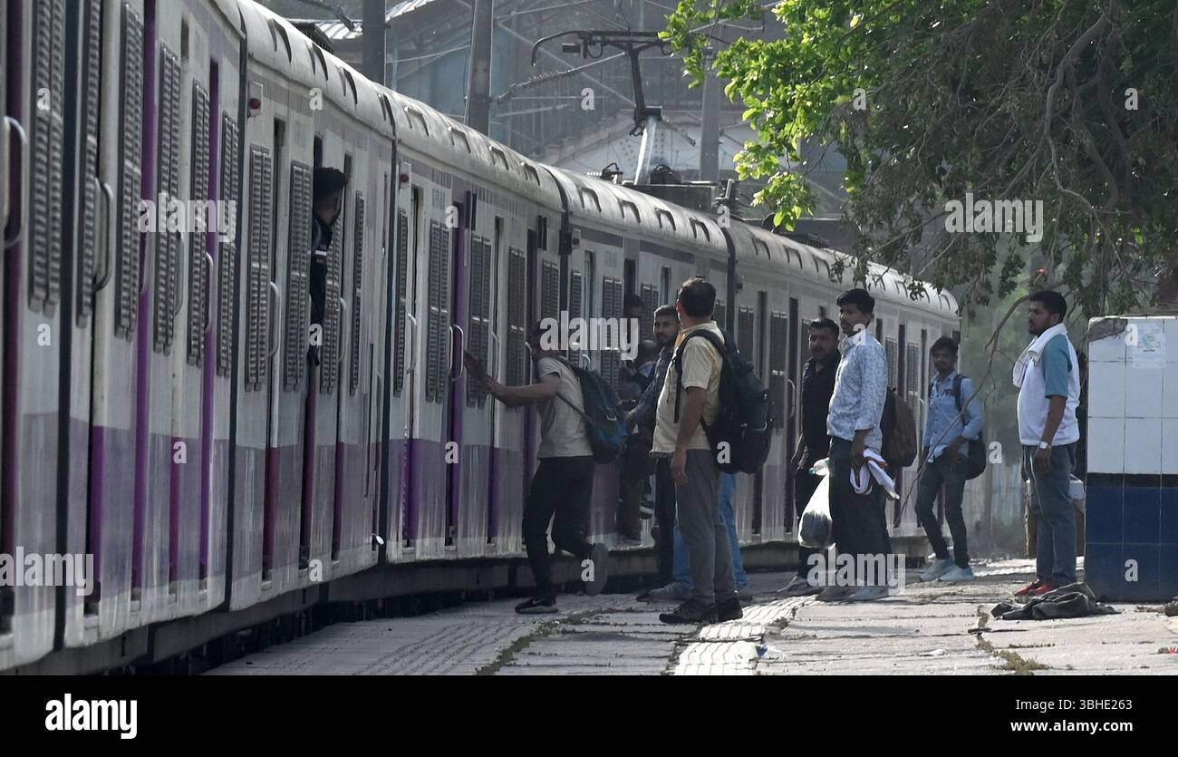 NEW DELHI, INDIA - JUNE 9: Passengers catch the EMU train at Tilak ...