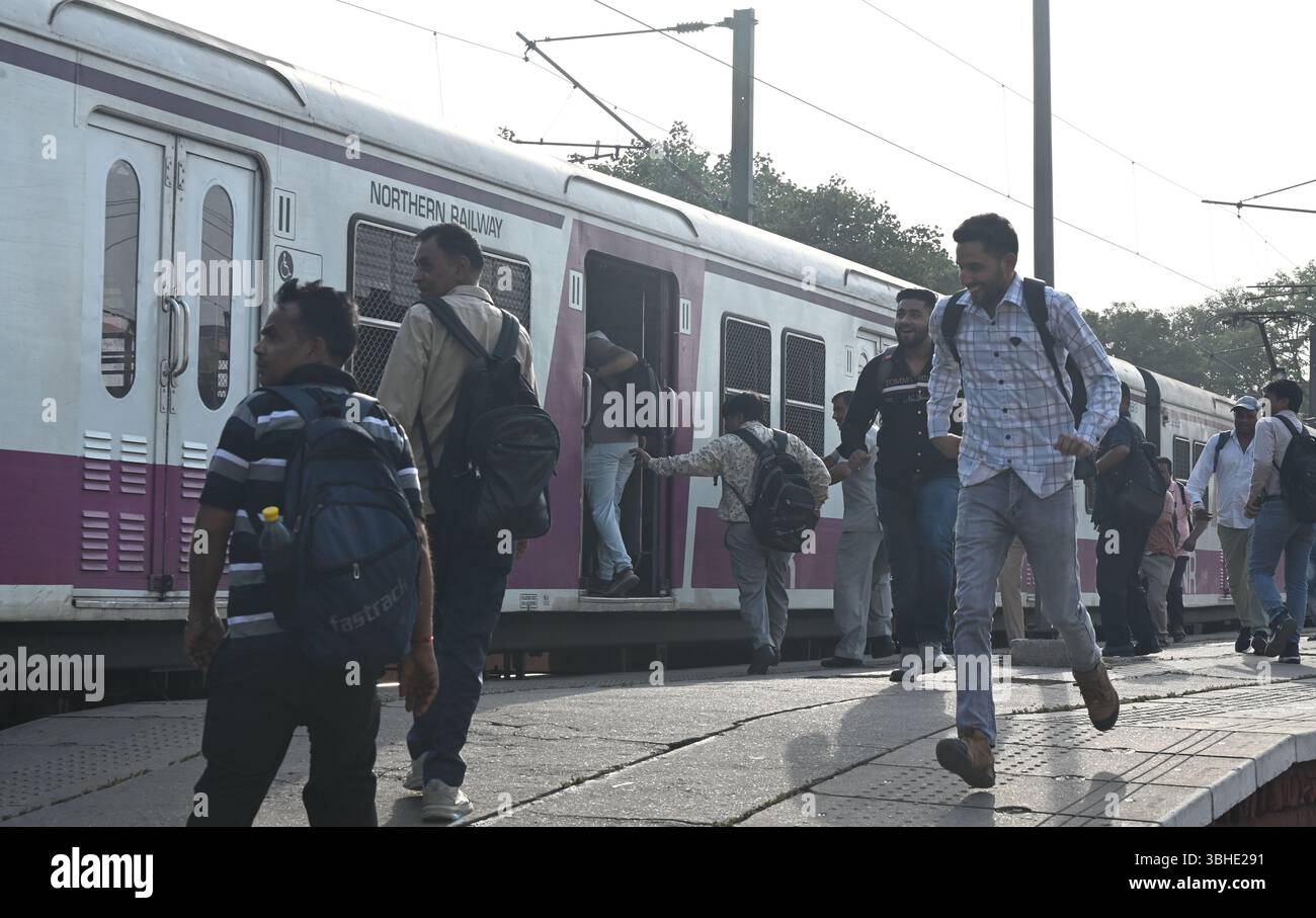 NEW DELHI, INDIA - JUNE 9: Passengers catch the EMU train at Tilak ...