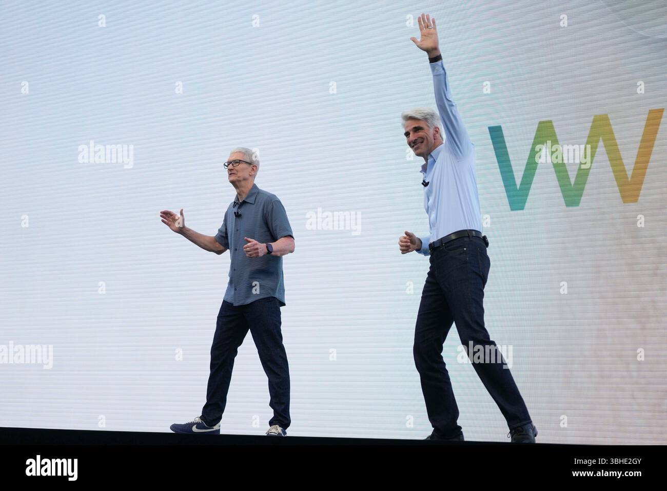 Apple CEO Tim Cook, left, is joined by Craig Federighi, senior vice ...