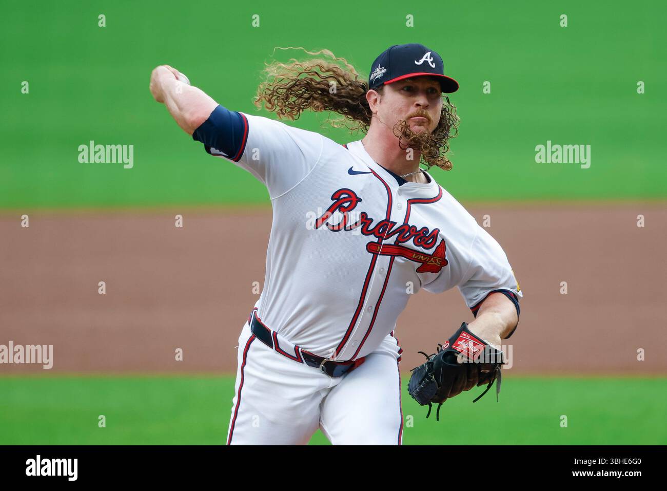 Grant Holmes #66 of the Atlanta Braves throws a pitch during a game ...
