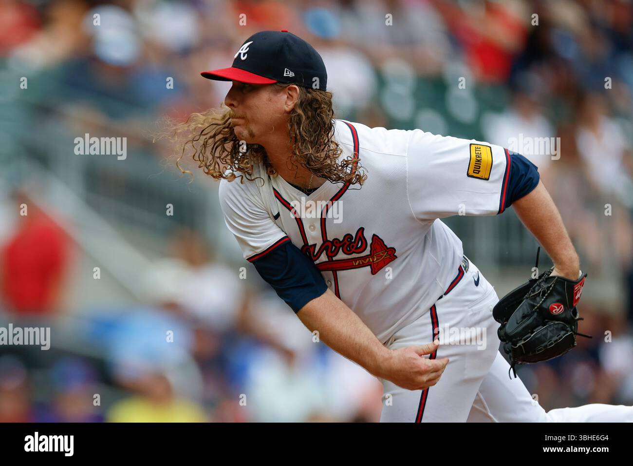 Grant Holmes #66 of the Atlanta Braves throws a pitch during a game ...