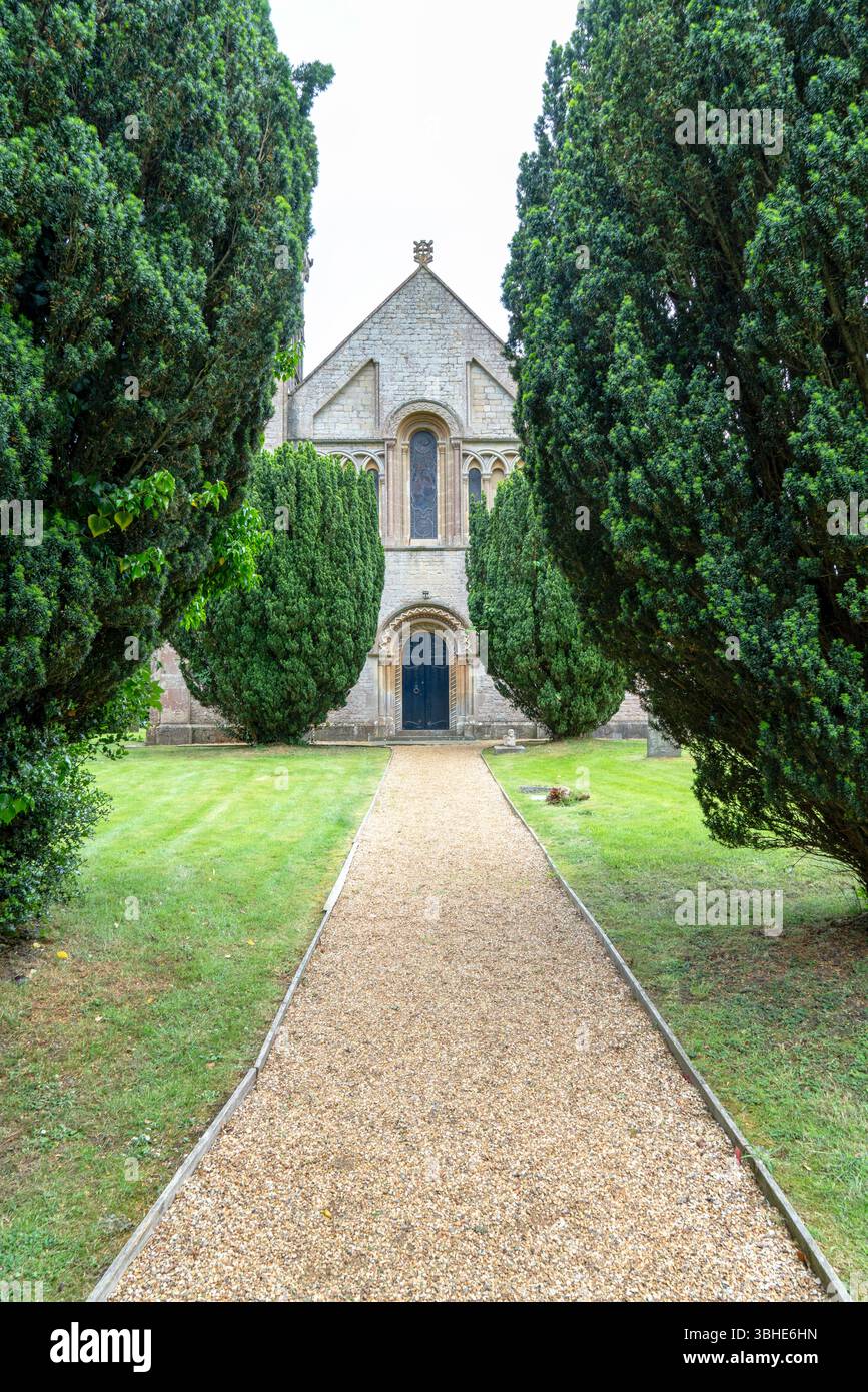 Gravel path leading to church door flanked by yew trees Stock Photo - Alamy