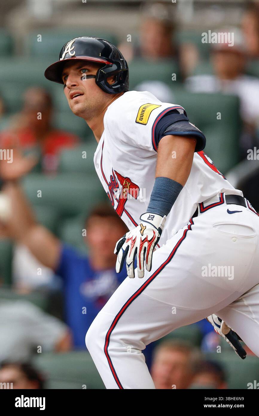 Austin Riley #27 of the Atlanta Braves watches the flight of his solo ...