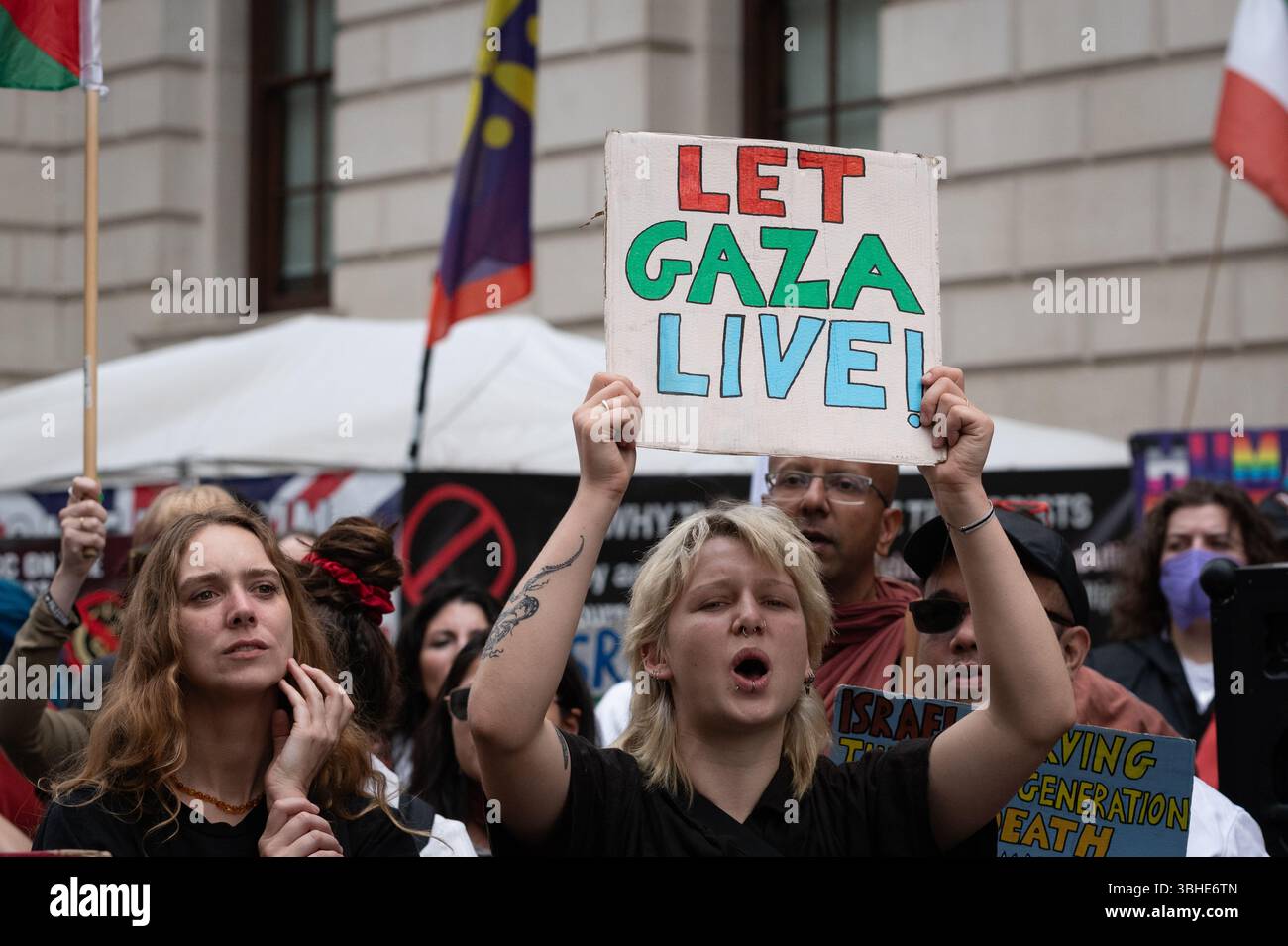 London, UK. 9 June, 2025. A placard reading "Let Gaza Live!" is held ...