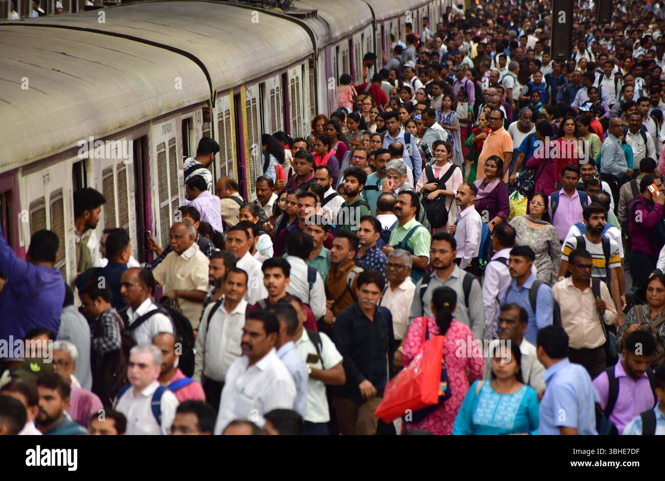 MUMBAI, INDIA - JUNE 9: Massive crowd waiting to catch their local ...