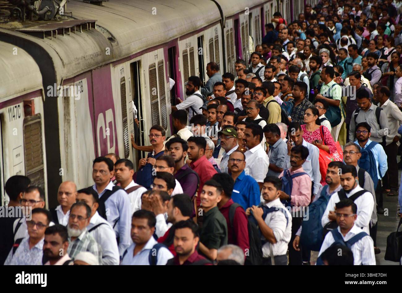 MUMBAI, INDIA - JUNE 9: Massive crowd waiting to catch their local ...