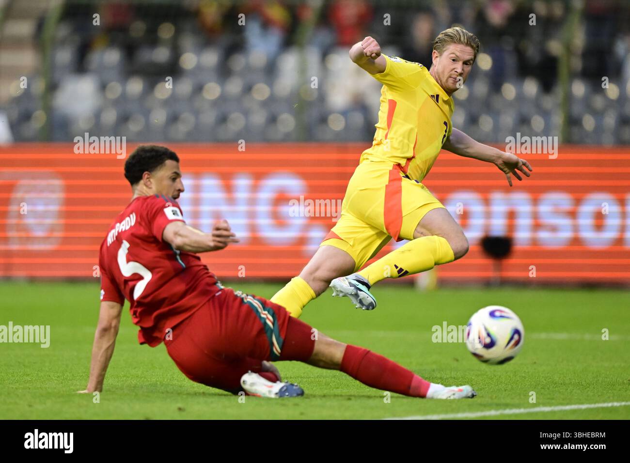 Belgium's Kevin De Bruyne (right) and Wales' Ethan Ampadu in action ...