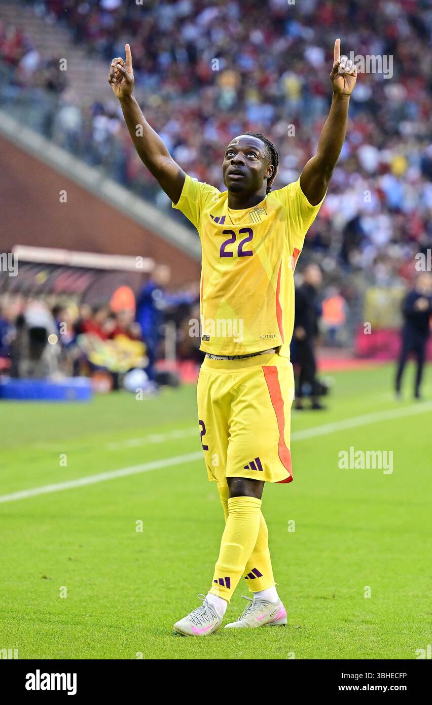 Belgium's Jeremy Doku celebrates scoring their side's third goal of the ...