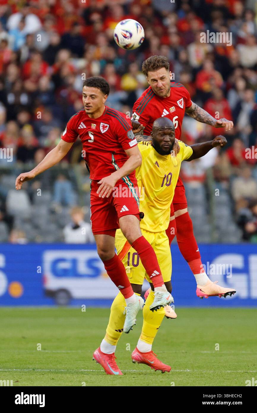 Wales' Ethan Ampadu, left, and Wales' Joe Rodon, right, go up against ...