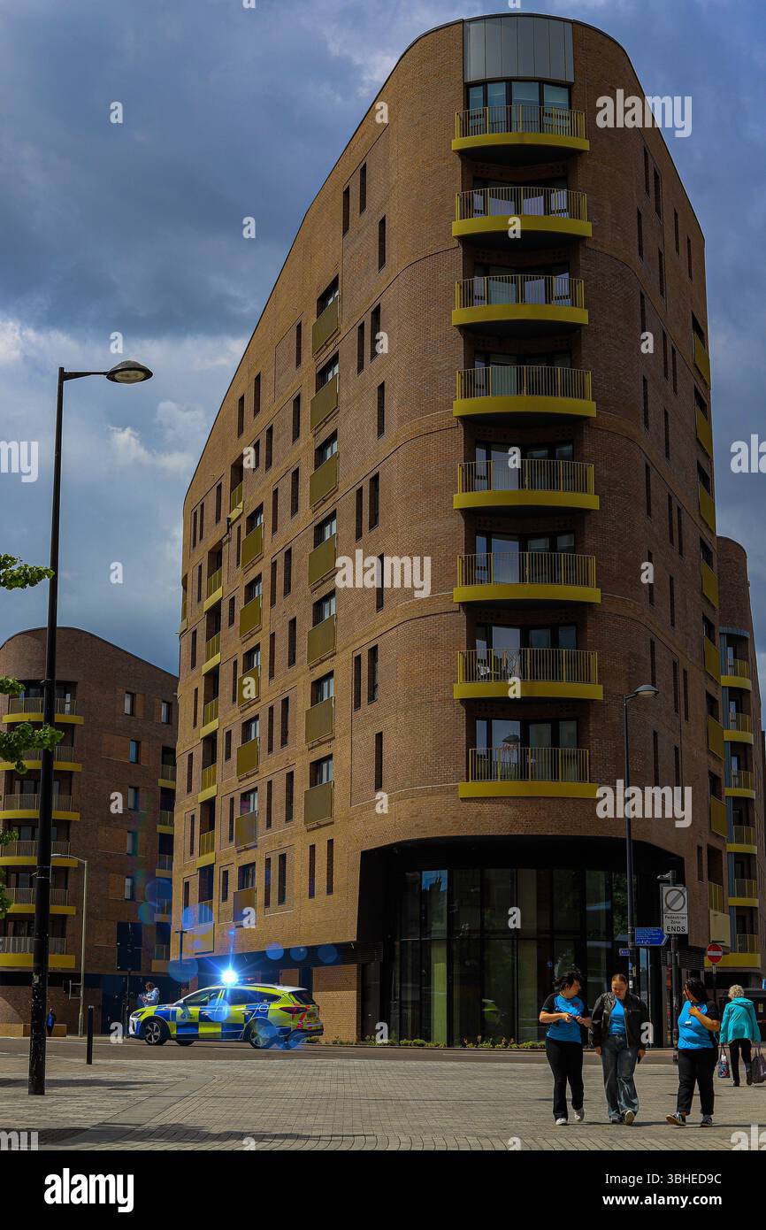 A speeding Police response vehicle with flashing blue lights attending ...
