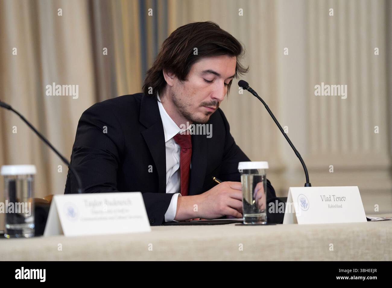 RobinHood CEO Vlad Tenev listens during an "Invest in America ...