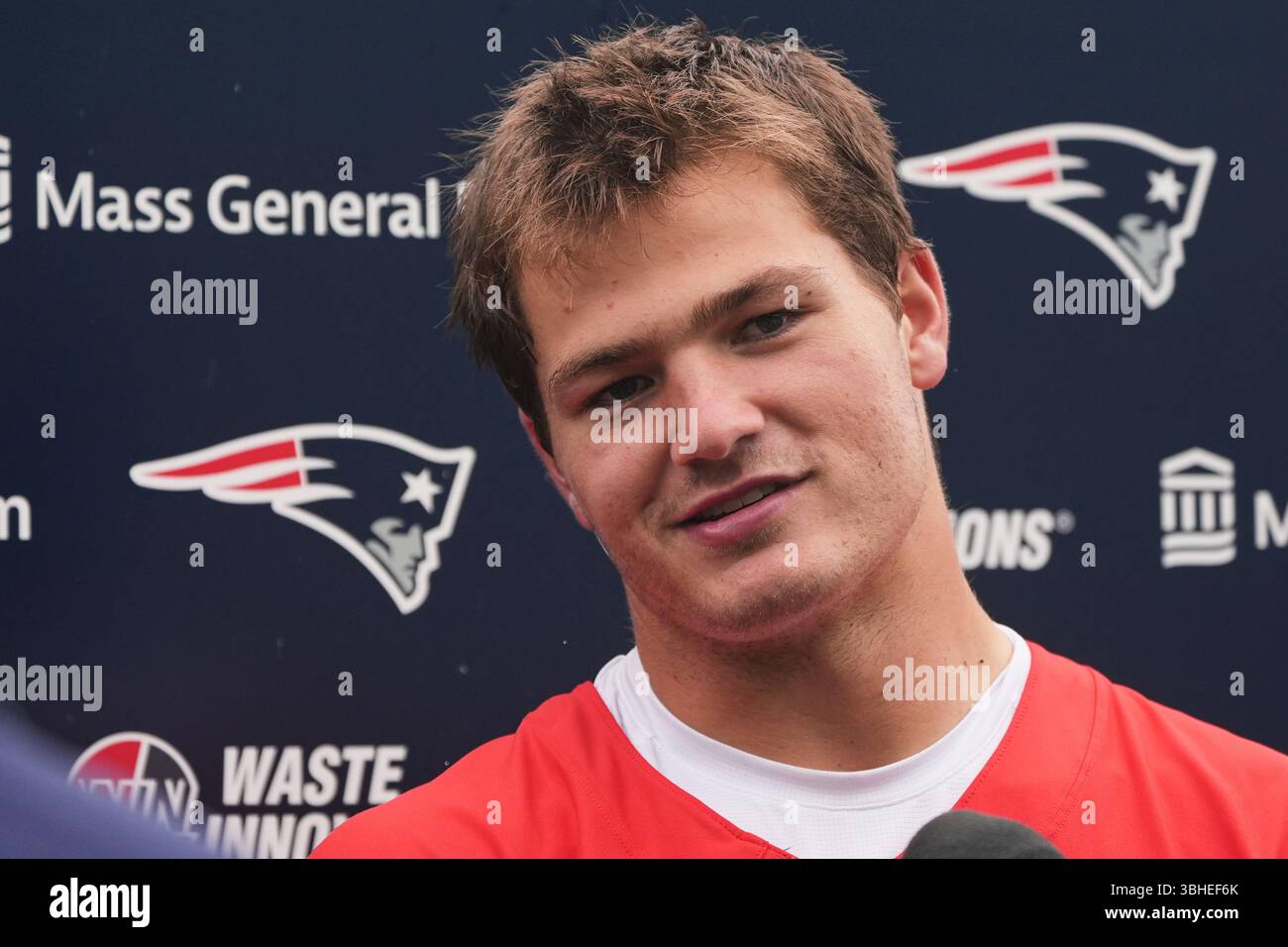 New England Patriots quarterback Drake Maye listens to a reporter's ...