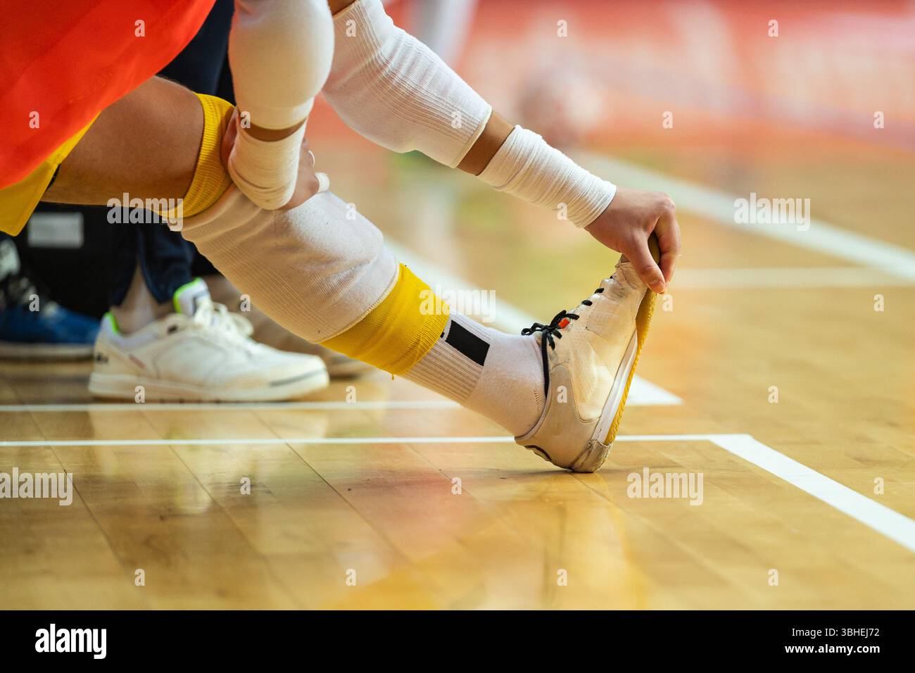 The leg of a futsal player during warm-up Stock Photo - Alamy