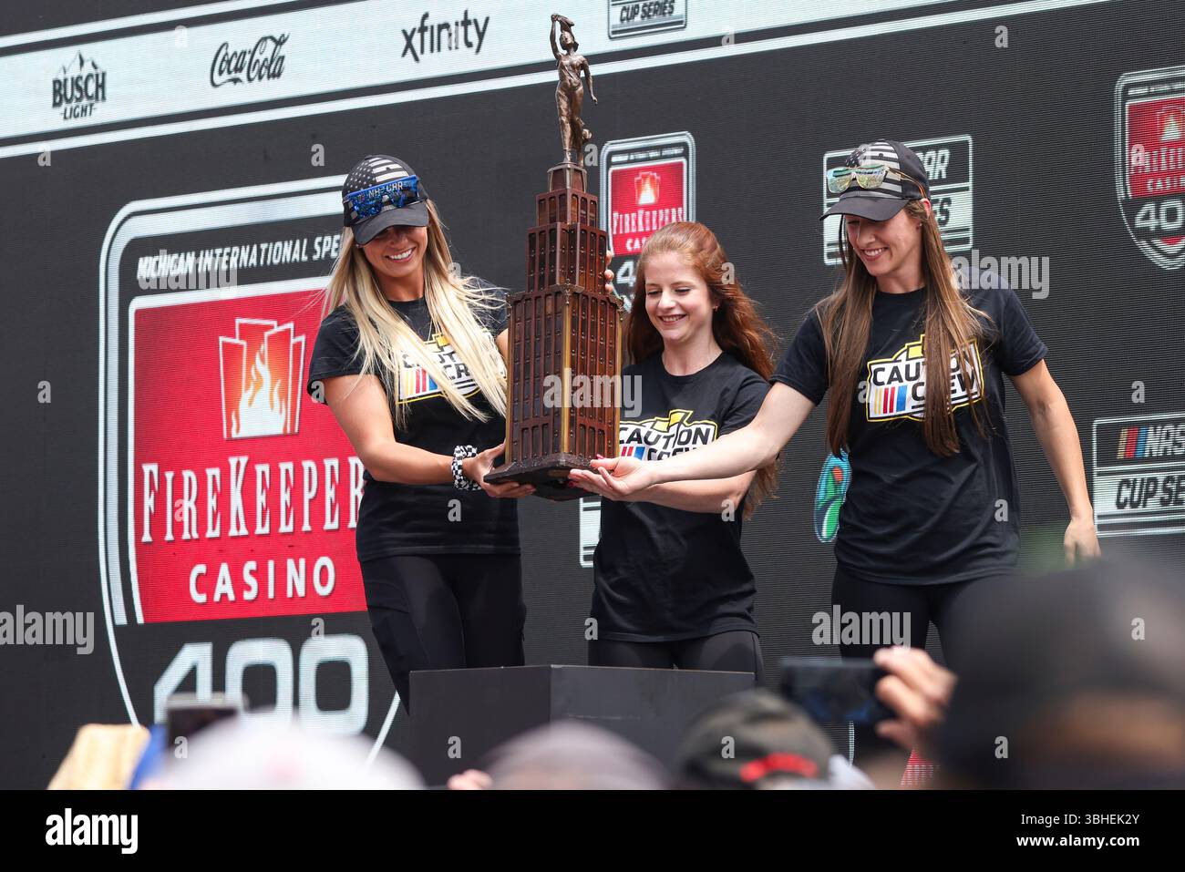 BROOKLYN, MI - JUNE 08: Members of the Caution Crew carry the Michigan ...
