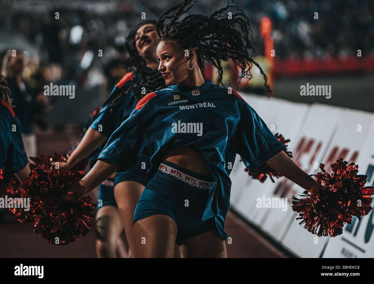Cheerleaders Performing on Sidelines at Montreal Alouettes CFL Game ...