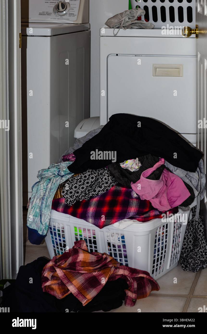 Clothes piled in laundry machine hi-res stock photography and images ...