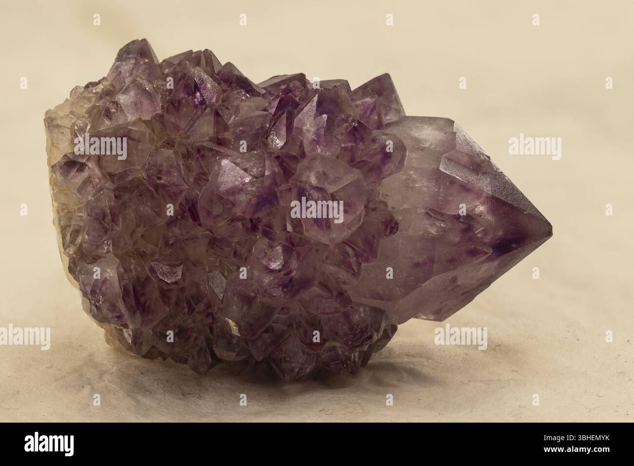 Macro shot of a raw amethyst crystal featuring vibrant violet ...