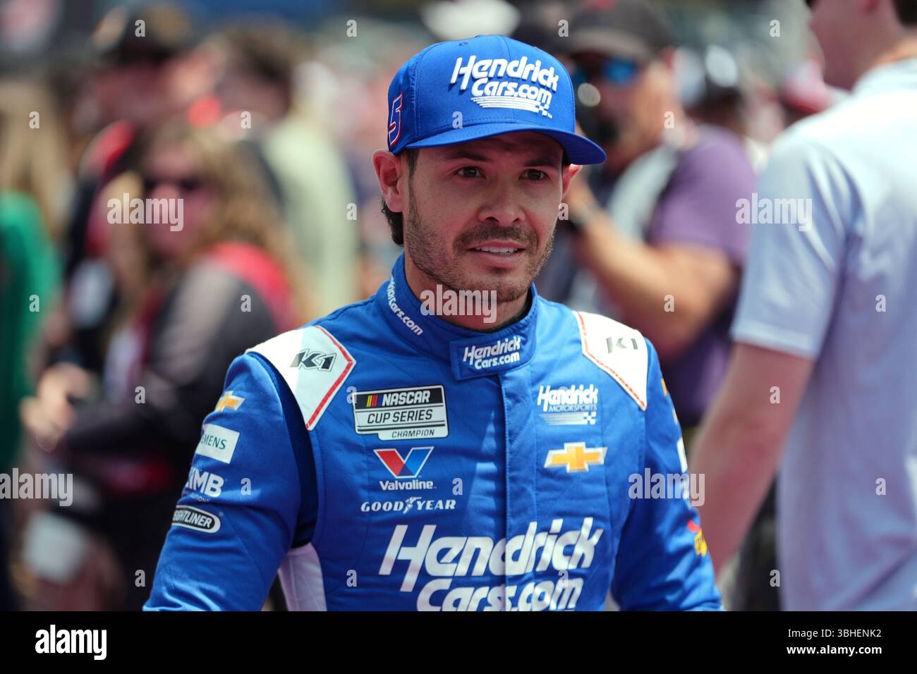 Kyle Larson walks to his car before a NASCAR Cup Series auto race at ...