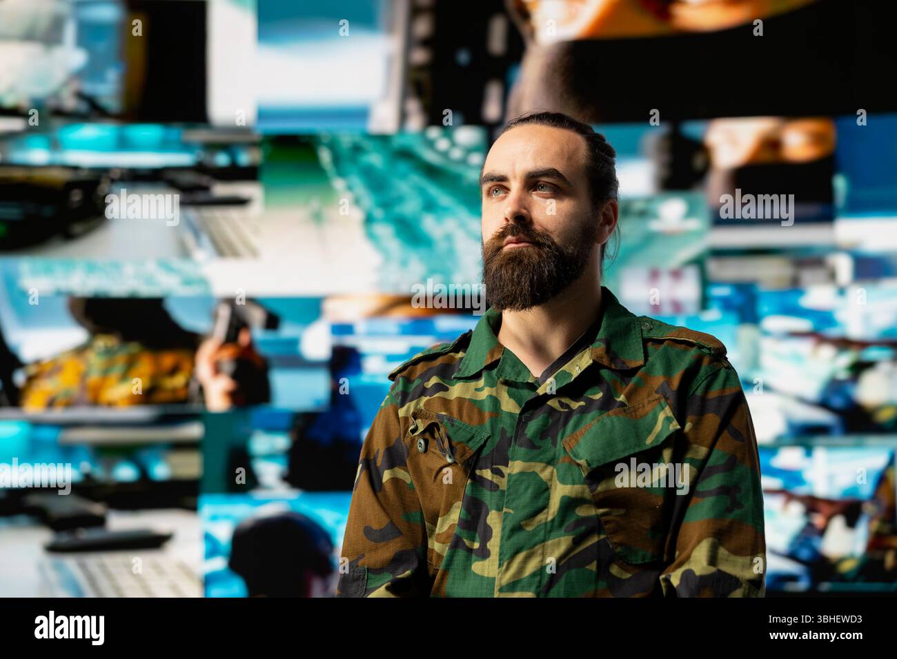 Armed forces officer monitoring drone and satellite imagery to gather ...