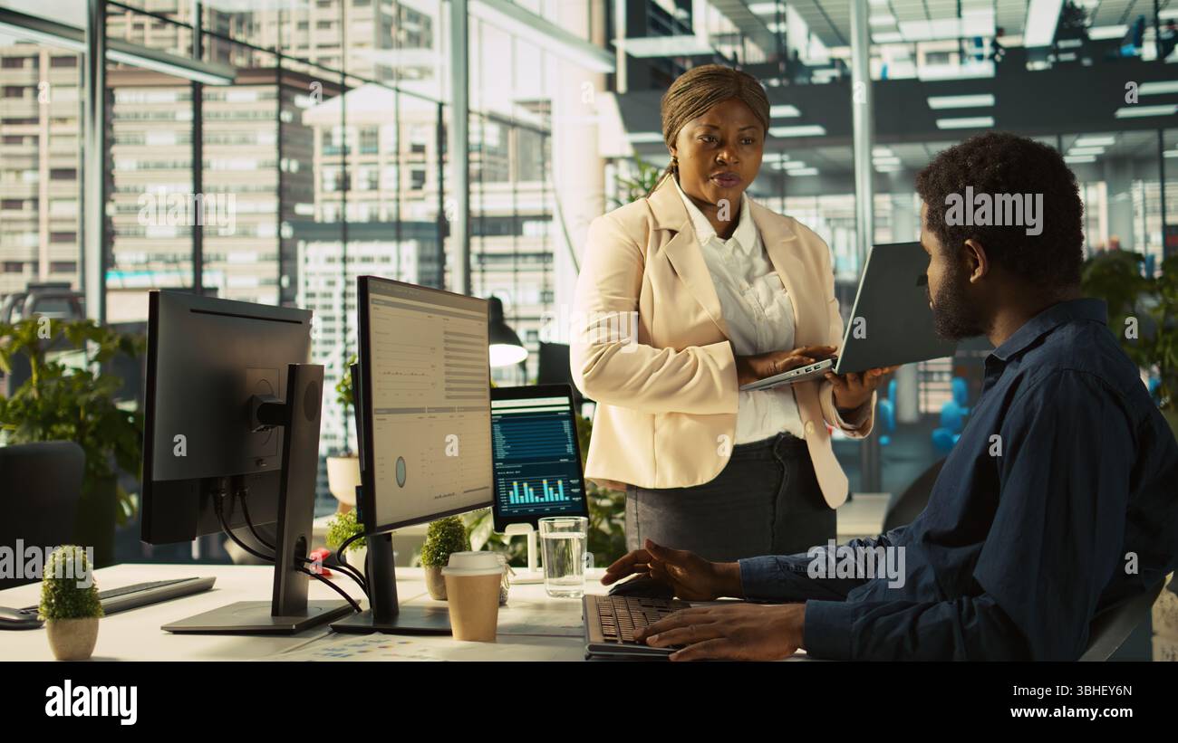 Manager in office ensuring worker hi-res stock photography and images ...