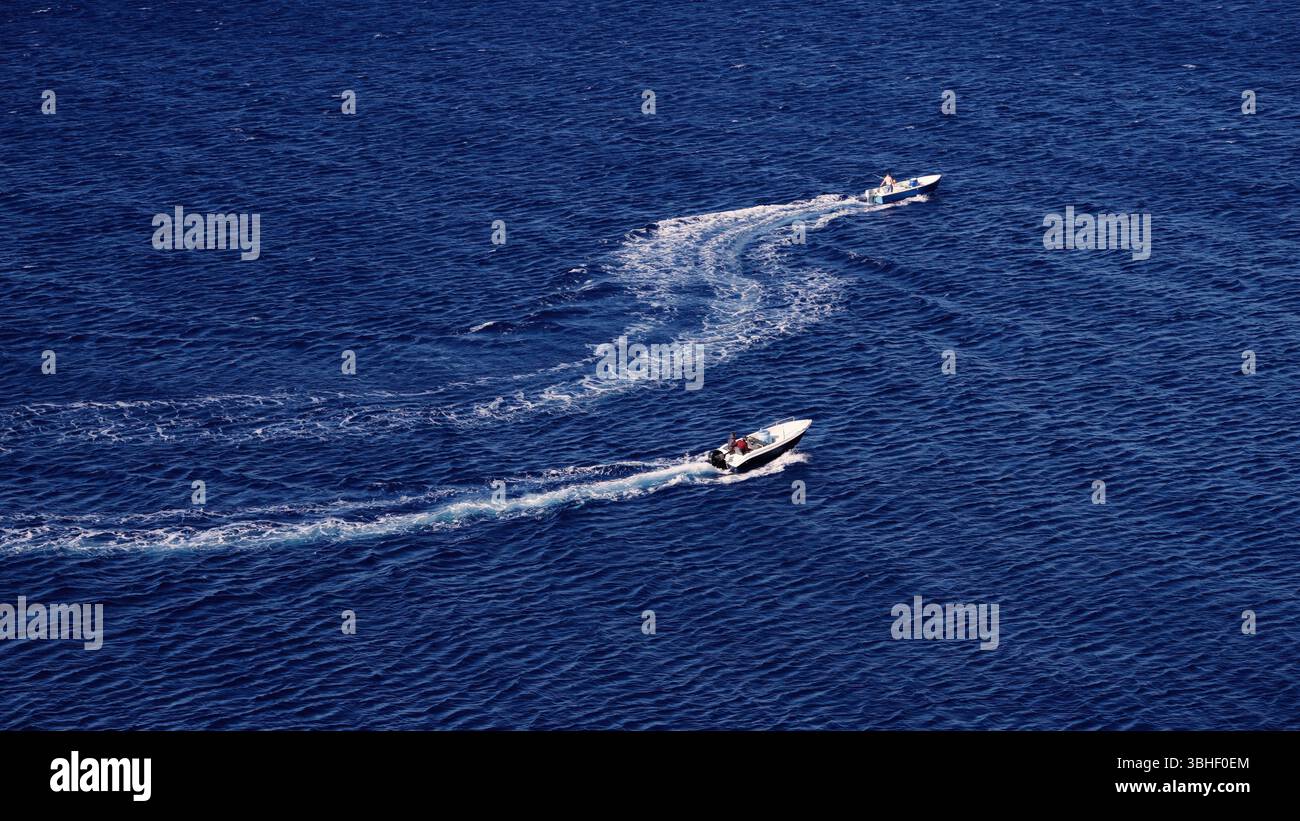 SCILLA, ITALY - JUNE 4, 2025 - Two motorboats are sailing fast on the ...