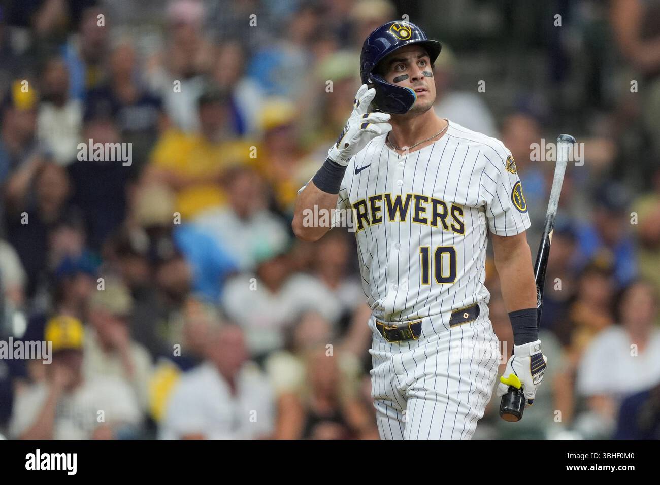 Milwaukee Brewers' Sal Frelick looks on after striking out during a ...