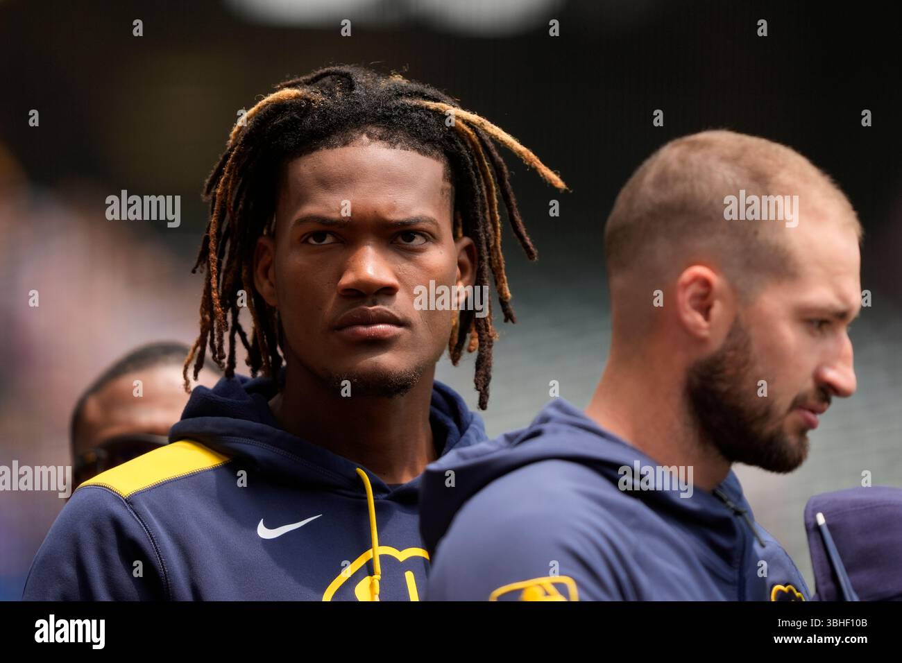 Milwaukee Brewers' Abner Uribe looks on before a baseball game against ...
