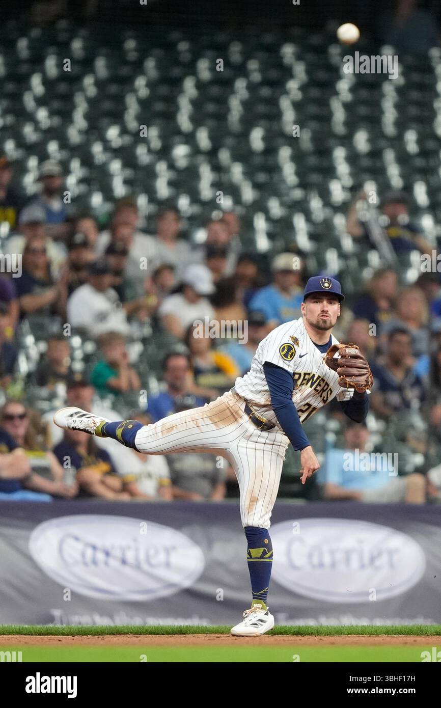 Milwaukee Brewers' Caleb Durbin throws to first base during a baseball ...