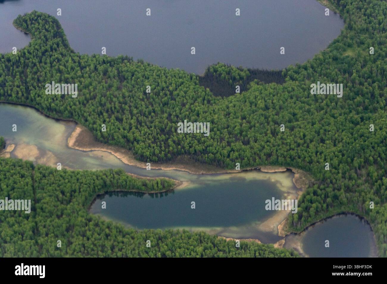 In this image taken through a plane window, part of Chugach National ...