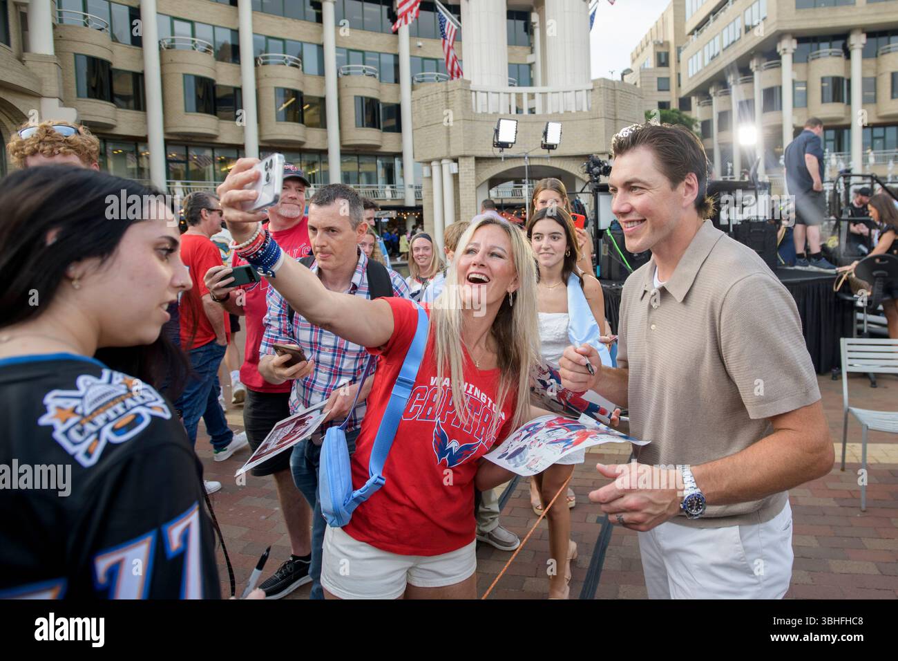 Washington Capitals forward T.J. Oshie, right, poses for a selfie with ...